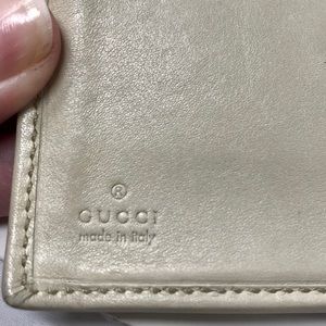 Gucci | Bags | Gucci Ivory Leather Gg Wallet With Gold Flip Lock | Poshmark